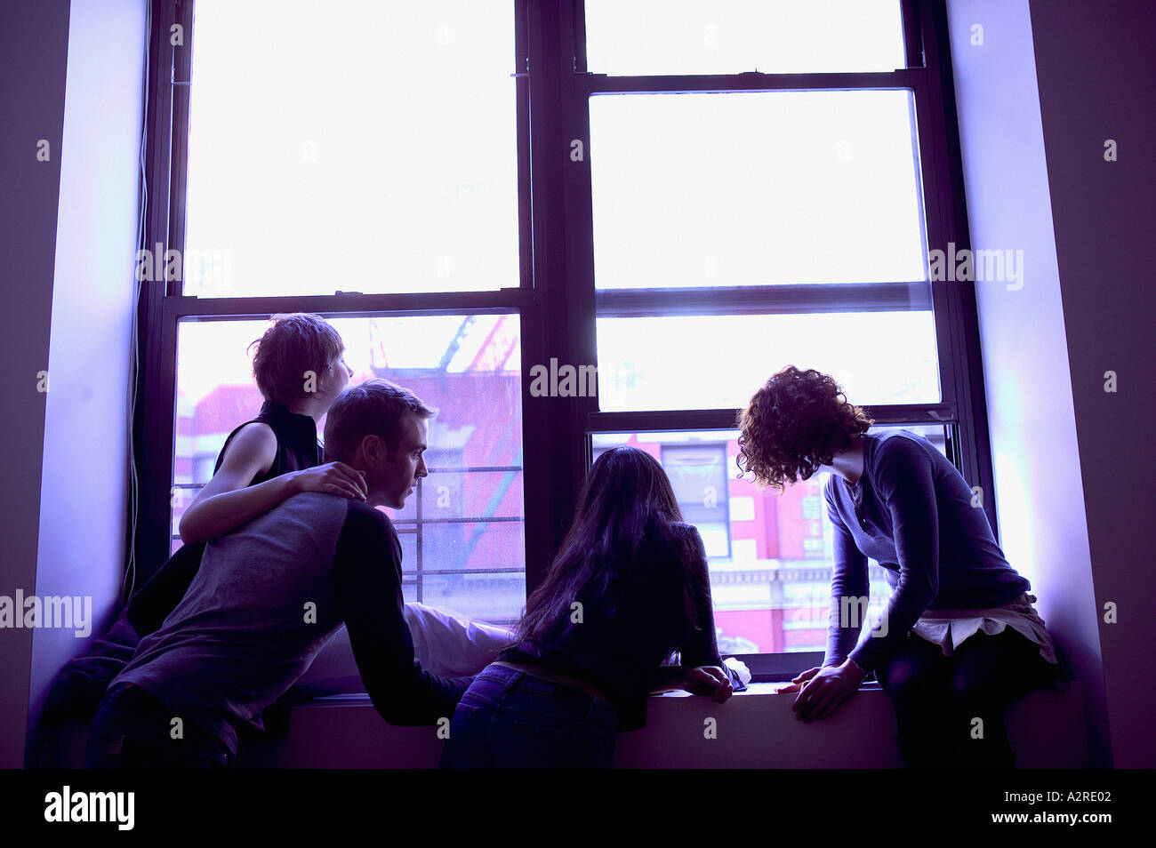 Silhouetted people at window Stock Photo - Alamy