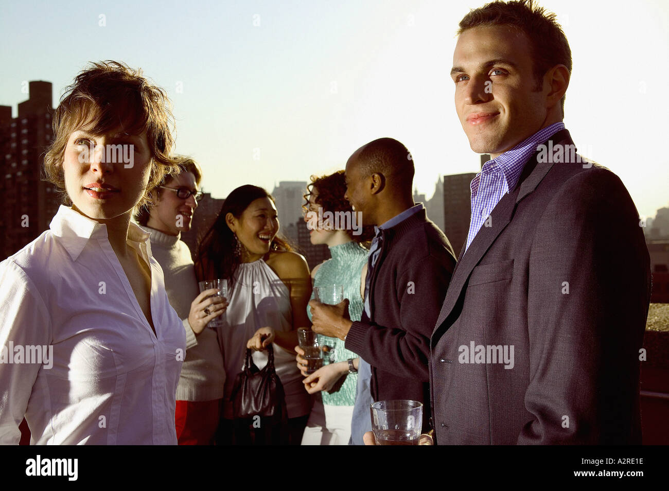 Stylish young people on rooftop Stock Photo - Alamy