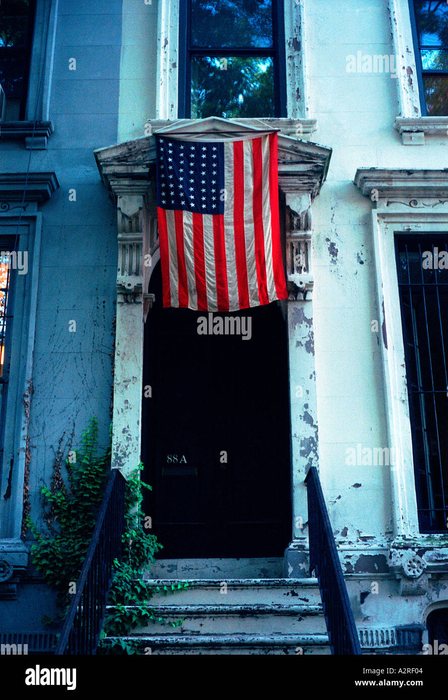 Flag hangs from door of Brooklyn brownstone Stock Photo - Alamy