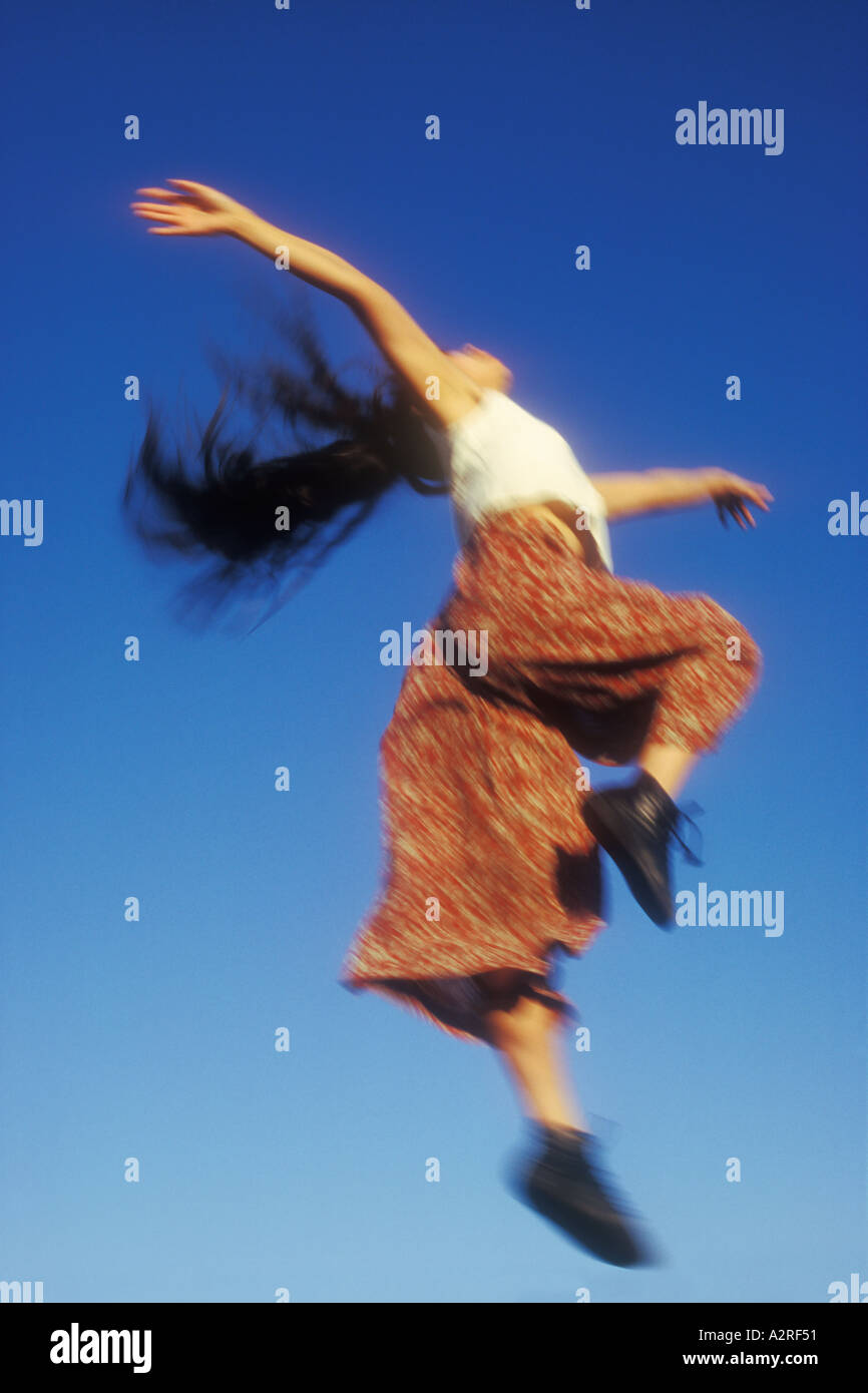 Japanese female leaping in air with hair flying Stock Photo - Alamy