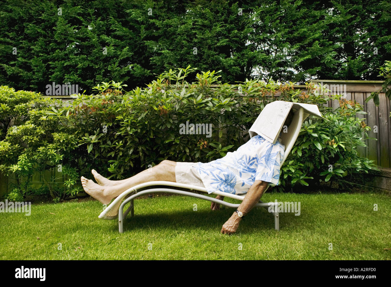 Man napping in his backyard Stock Photo - Alamy