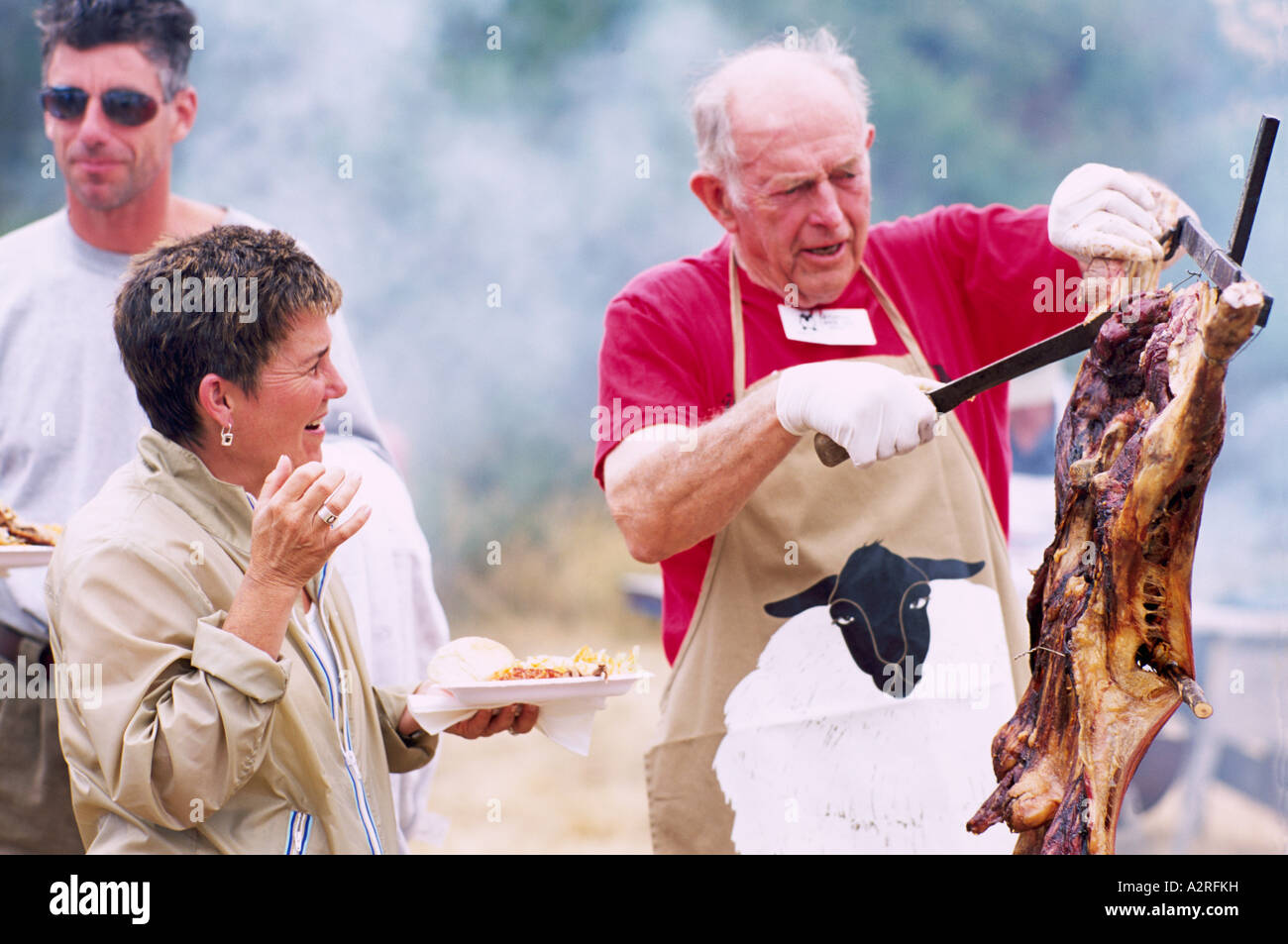 Carving and Serving Barbecued Saturna Island Lamb at Annual Summer ...