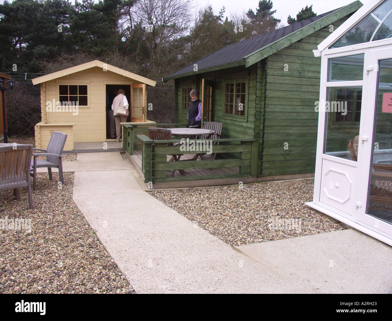 Timber cabins sheds on display in outdoor shop sales area Stock Photo ...