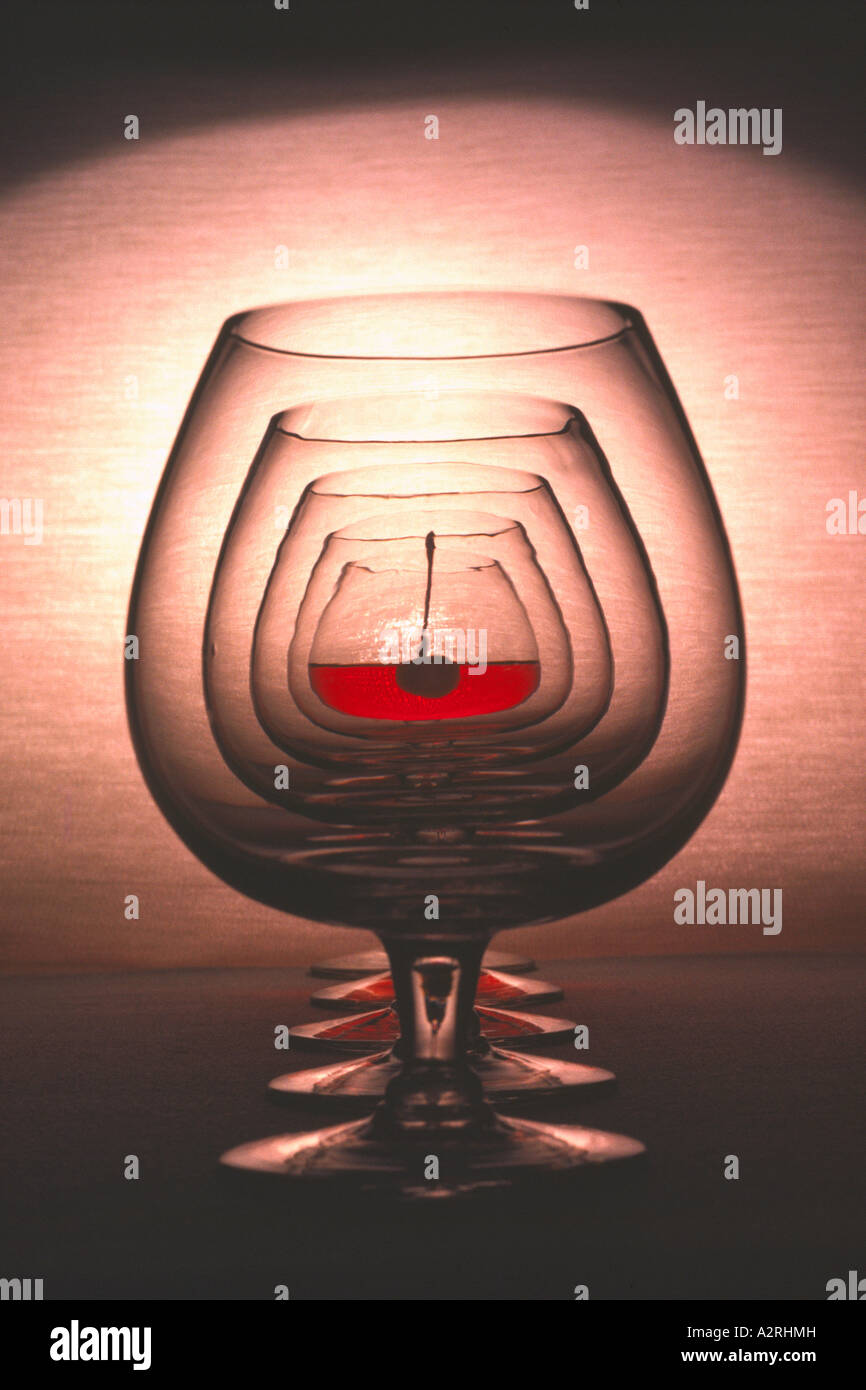 A Row of Brandy Glasses, One Glass Half Empty / Half Full Concept Stock ...