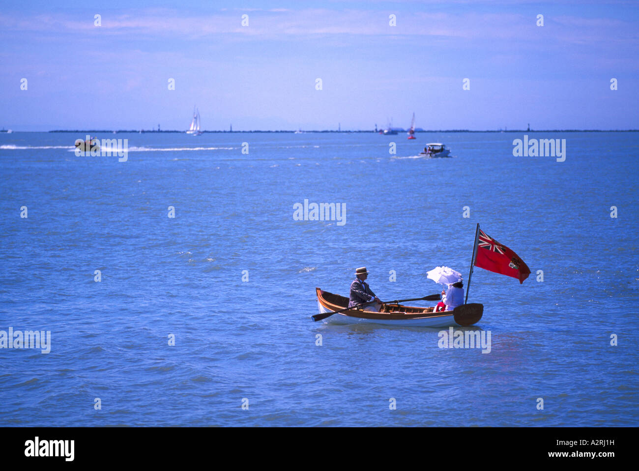 Gentleman and Lady in Historic Period Costume rowing in Rowboat with ...