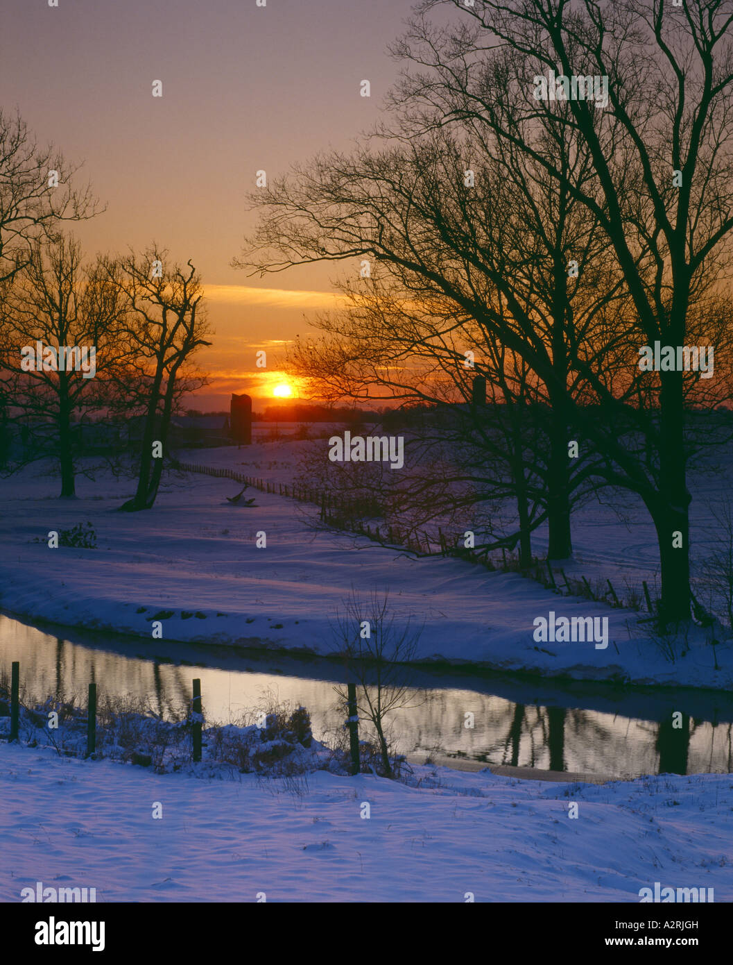 SUNSET OVER FARM Stock Photo - Alamy