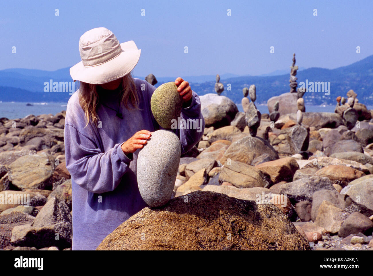 Artist balancing Rocks to Perfection Stock Photo - Alamy