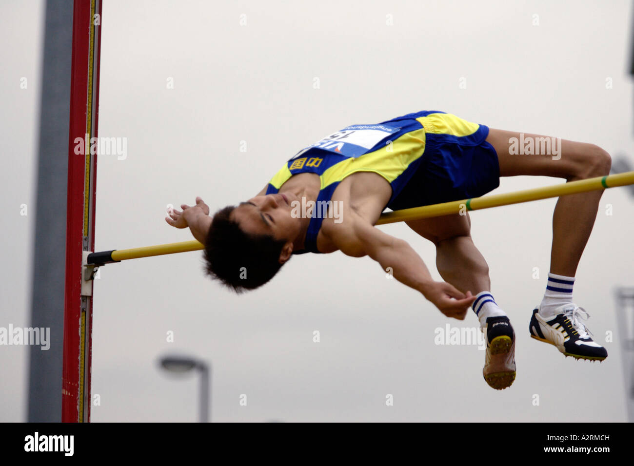 Qiu Hong Wang of China competes in the men s F46 High Jump competition ...