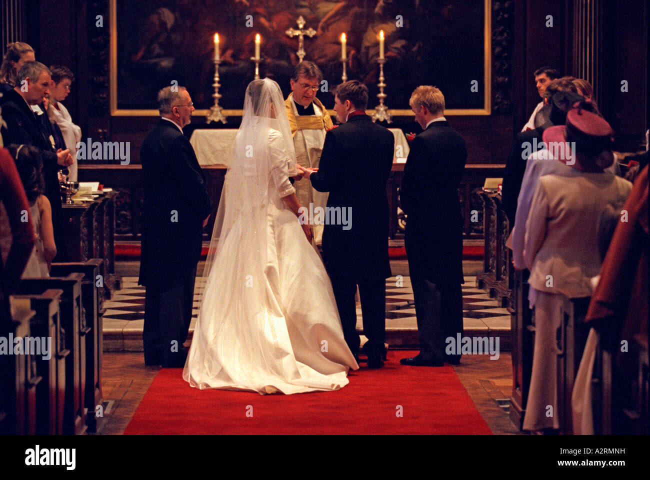 Bride at the alter with her Groom exchange wedding rings in St George's ...