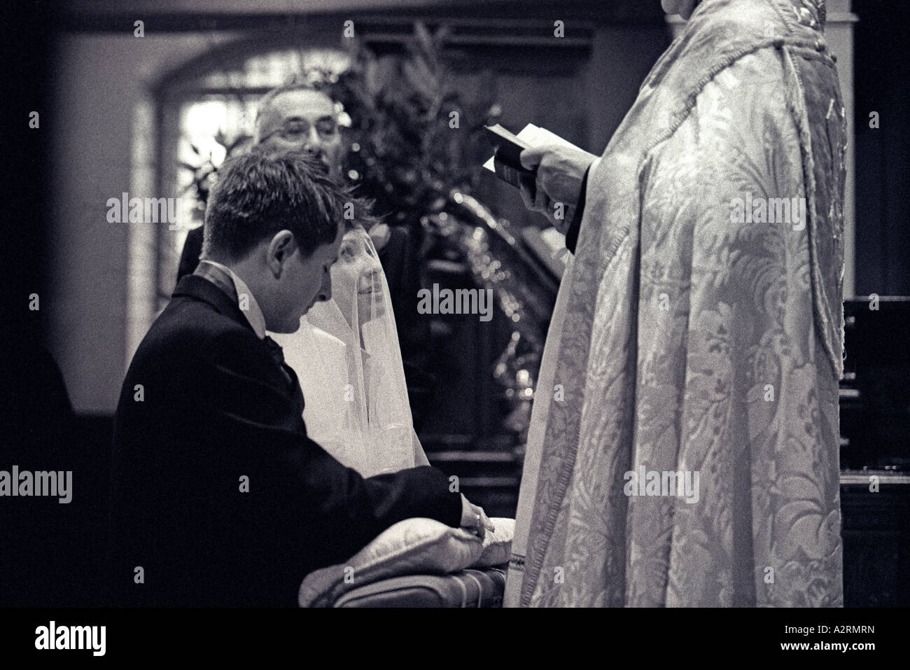 Bride at the alter with her Groom make their wedding vows in St George ...