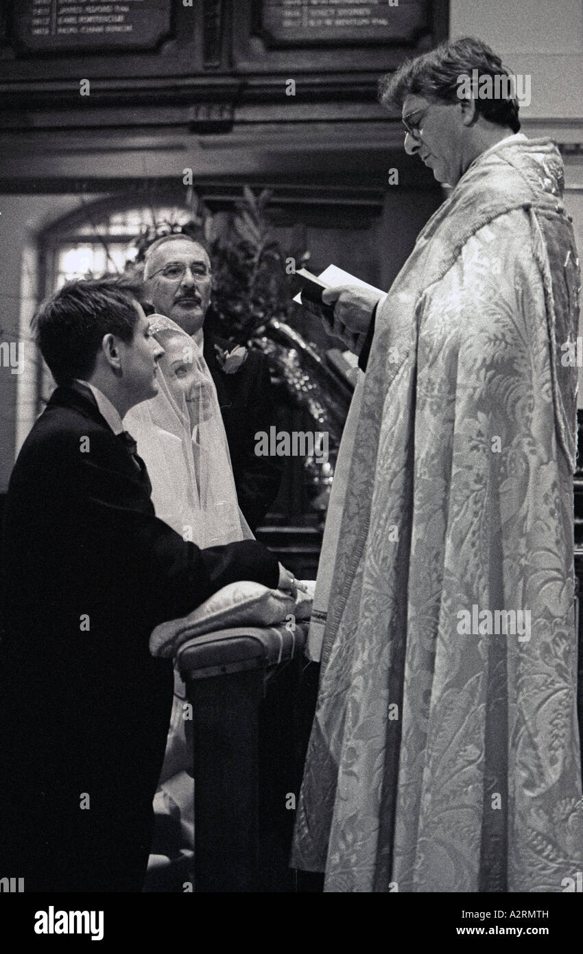 Bride at the alter with her Groom make their wedding vows in St George ...