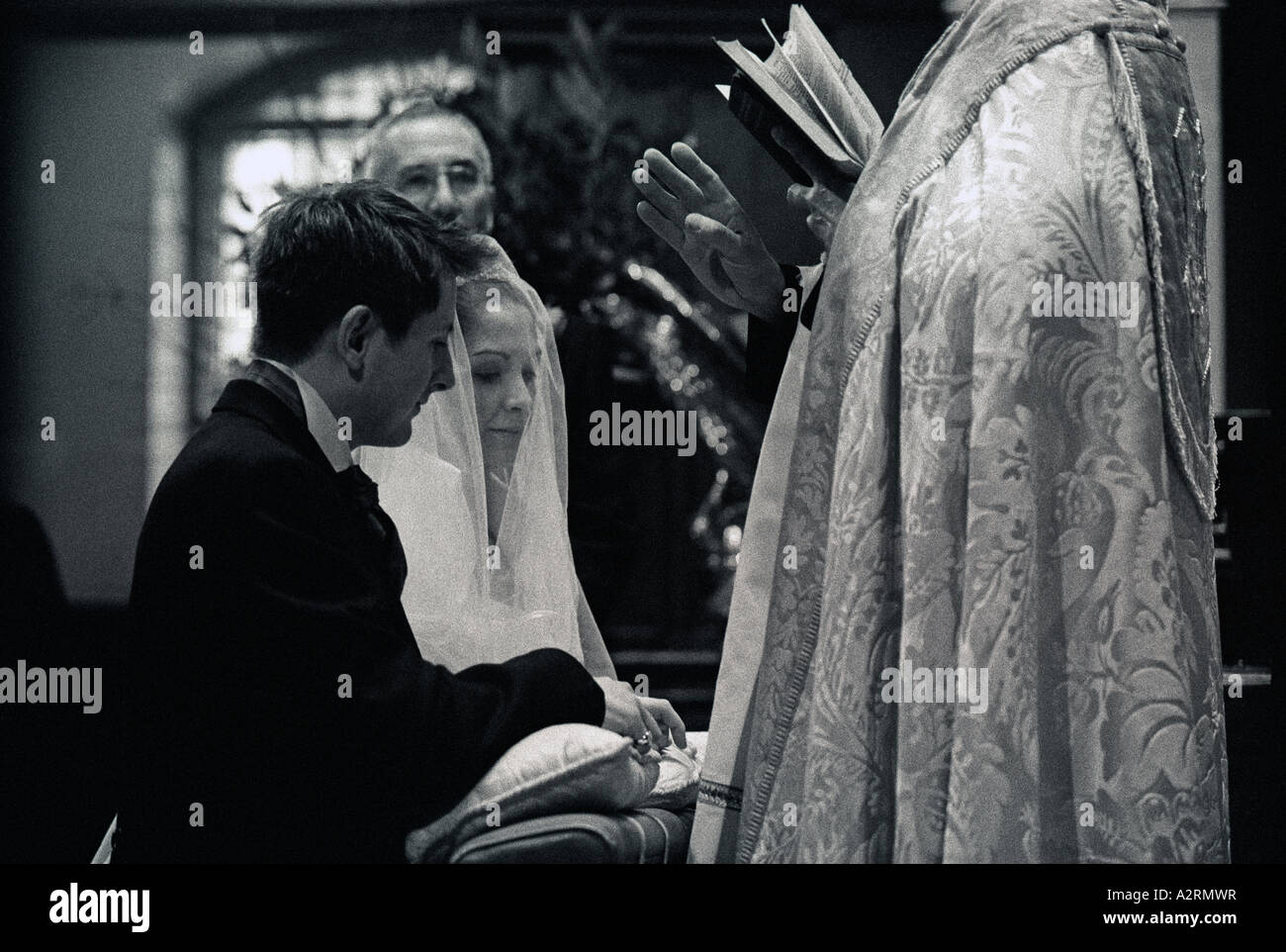 Bride at the alter with her Groom make their wedding vows in St George ...