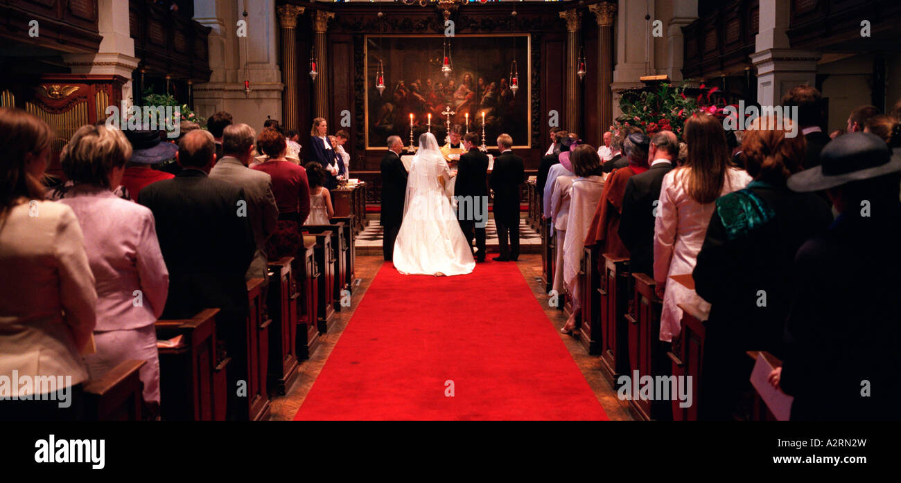 Bride at the alter with her Groom make their wedding vows in St George ...