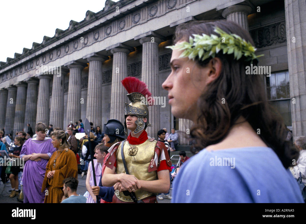 crowds performers in ancient roman costumes at a street performance ...