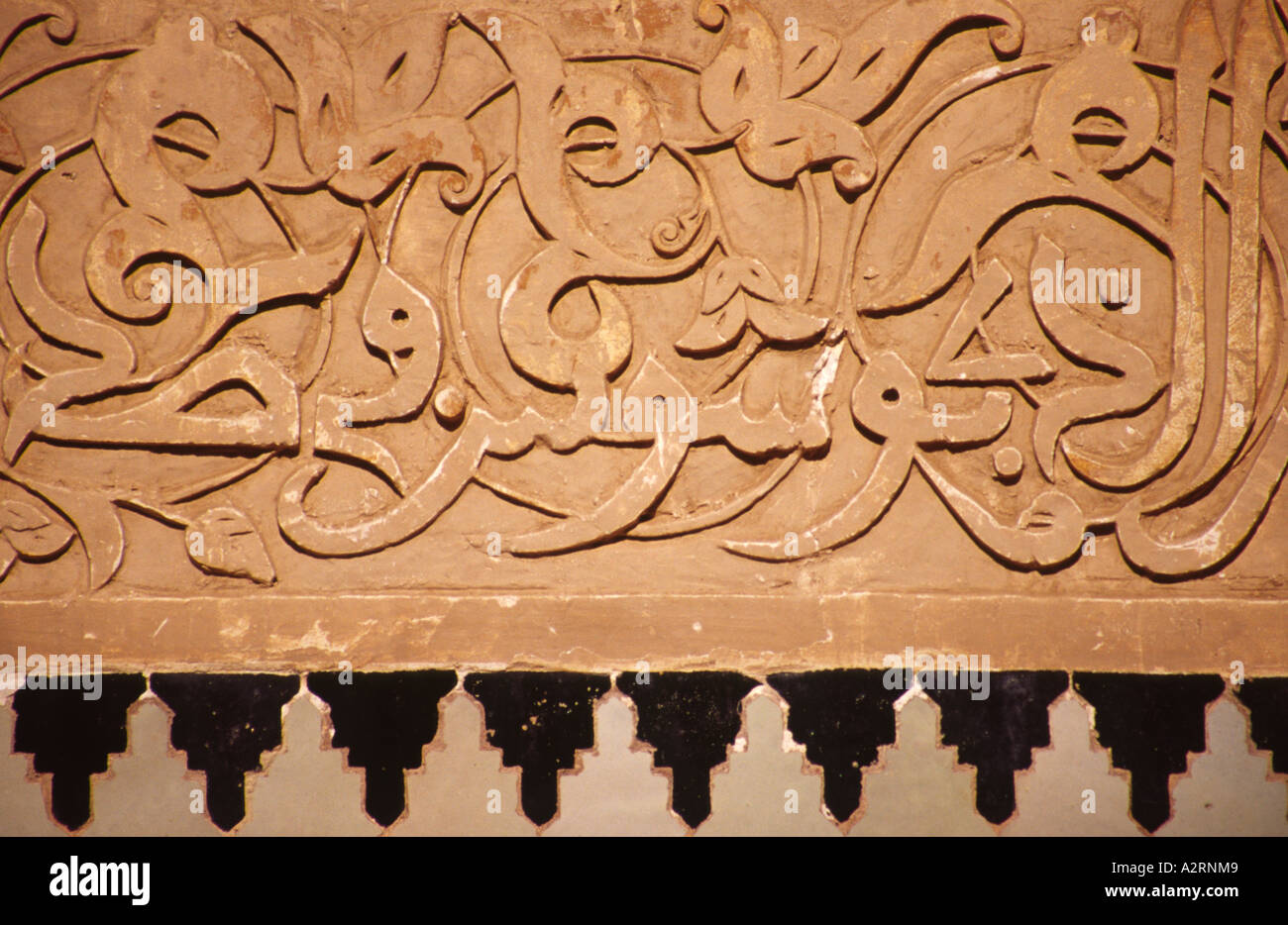 Stonework in wall of mosque decorated with arabic design, Morocco ...