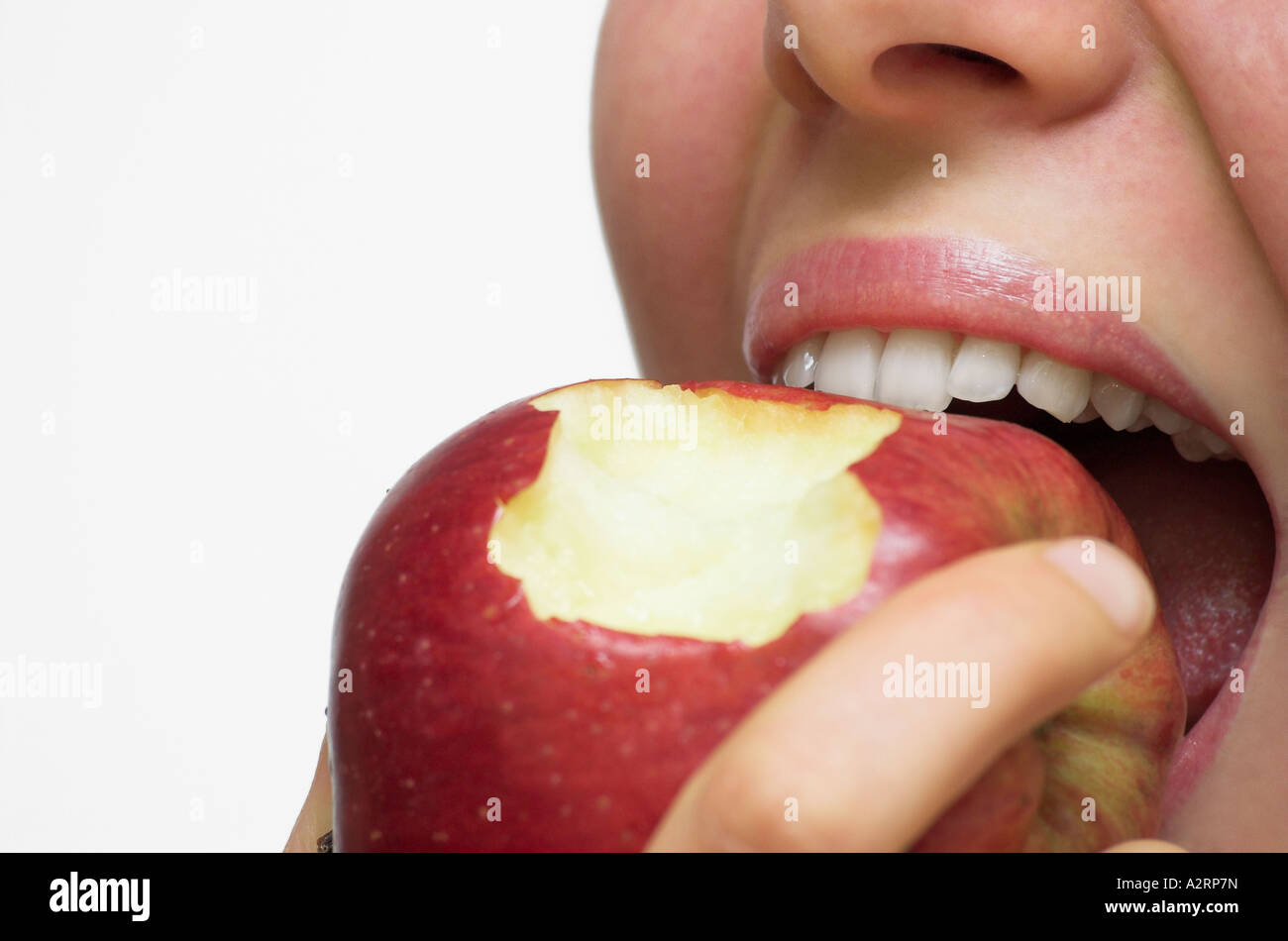 Young woman eating apple close up Stock Photo - Alamy