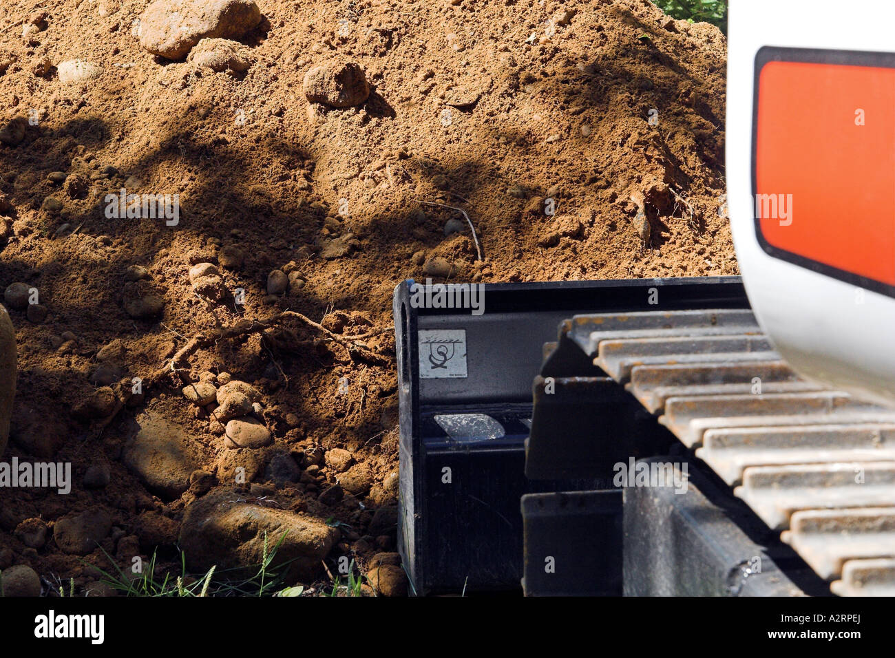 Digger By Pile of Dirt Stock Photo - Alamy