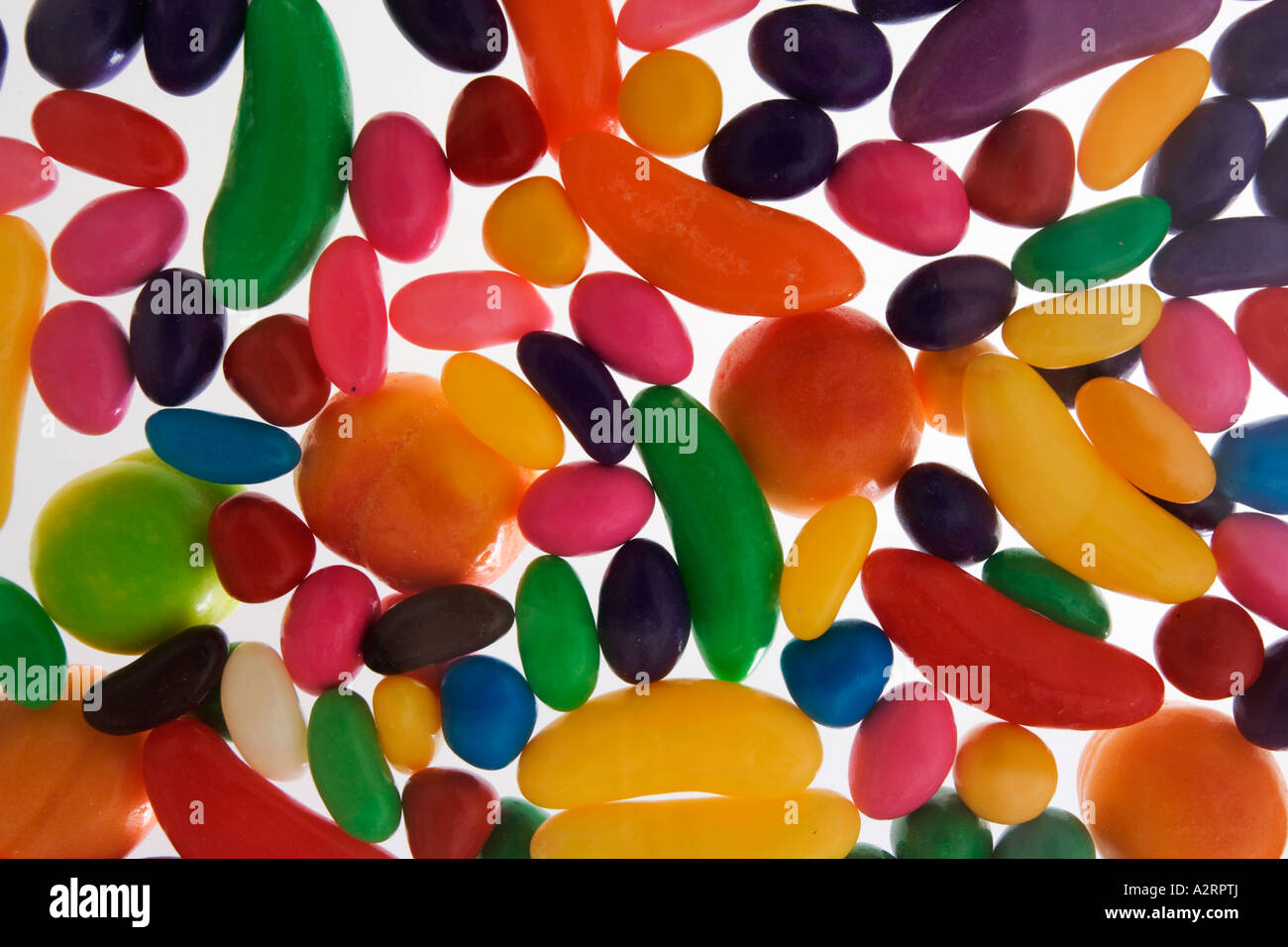 Multi coloured sweets White background Studio shot Stock Photo - Alamy