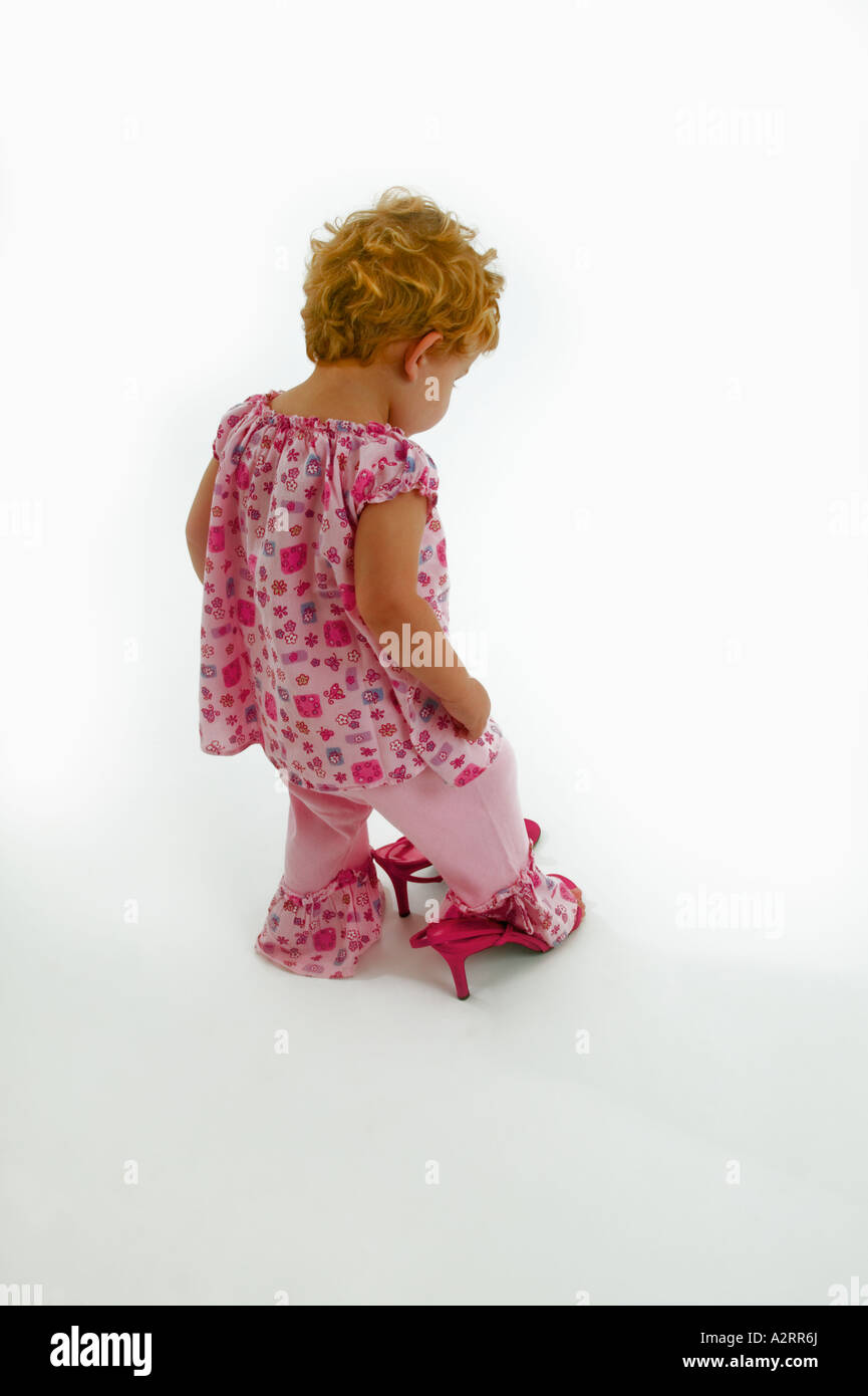 Child 18 months with high heel shoes Model released Studio shot Stock ...