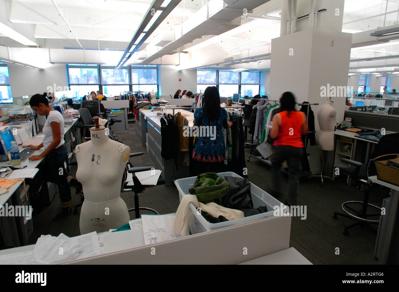 Workers in an office in the fashion industry Stock Photo - Alamy