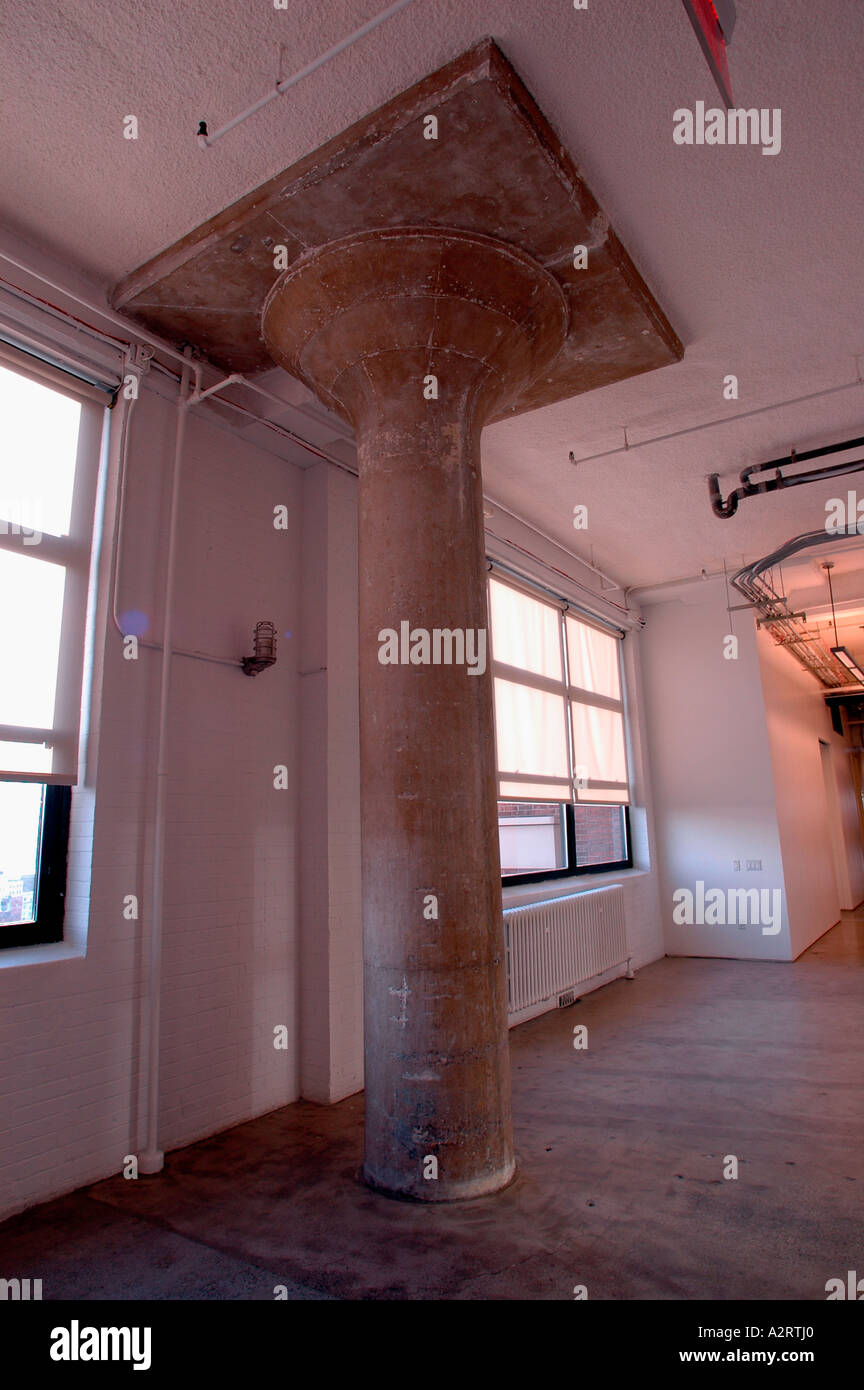 Structural column incorporated into office building renovation Stock ...