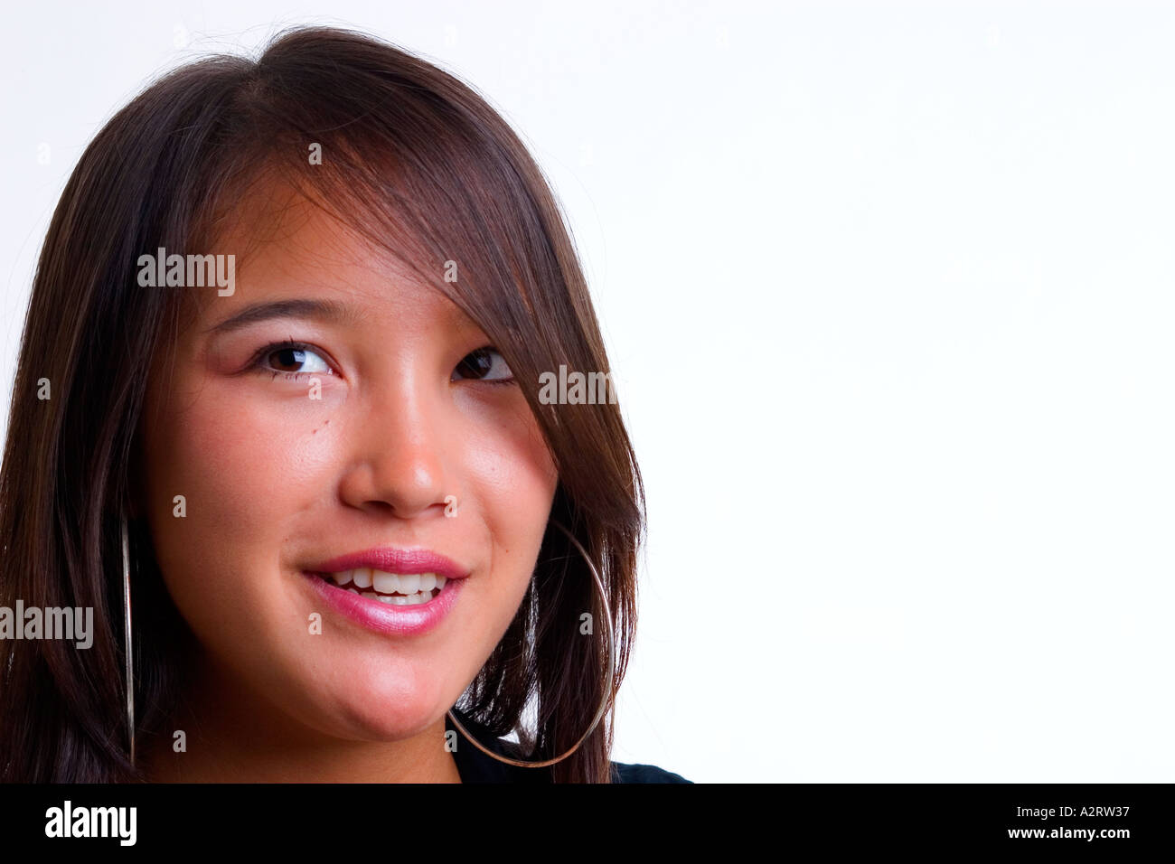 Headshot of young beautiful asian model smiling thoughtfully Stock ...