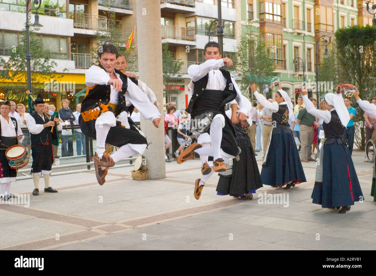 Asturian traditional dance group with two men jumping in the air Stock ...