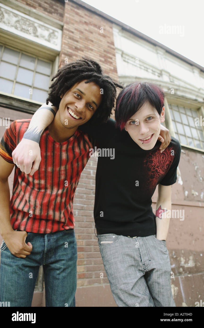 Two male friends posing Stock Photo - Alamy