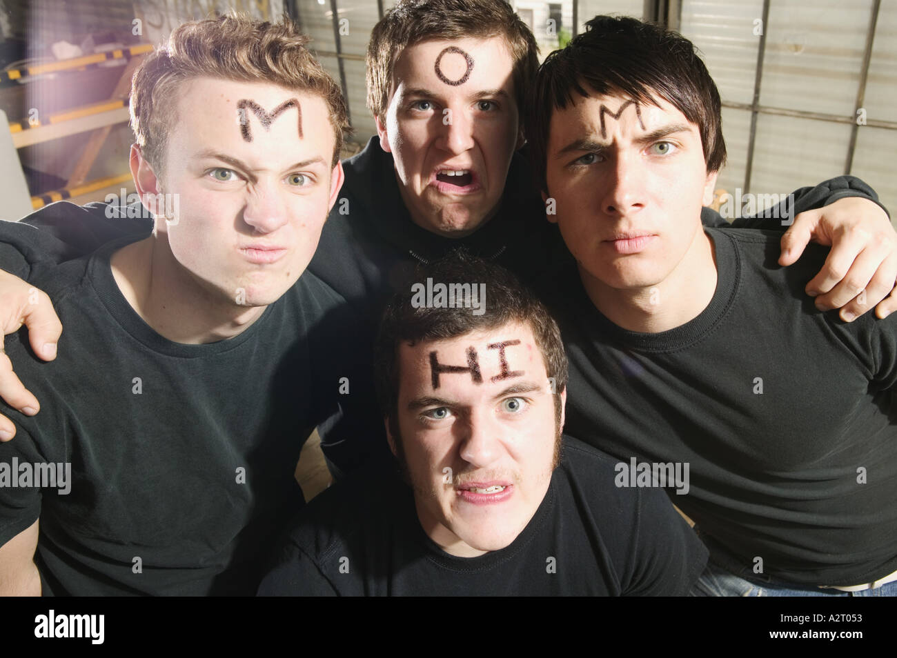 Four young men with Hi Mom on their foreheads Stock Photo - Alamy