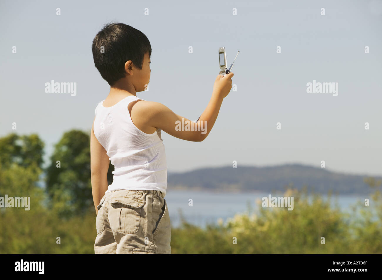 Young boy taking a photo with his mobile phone Stock Photo - Alamy