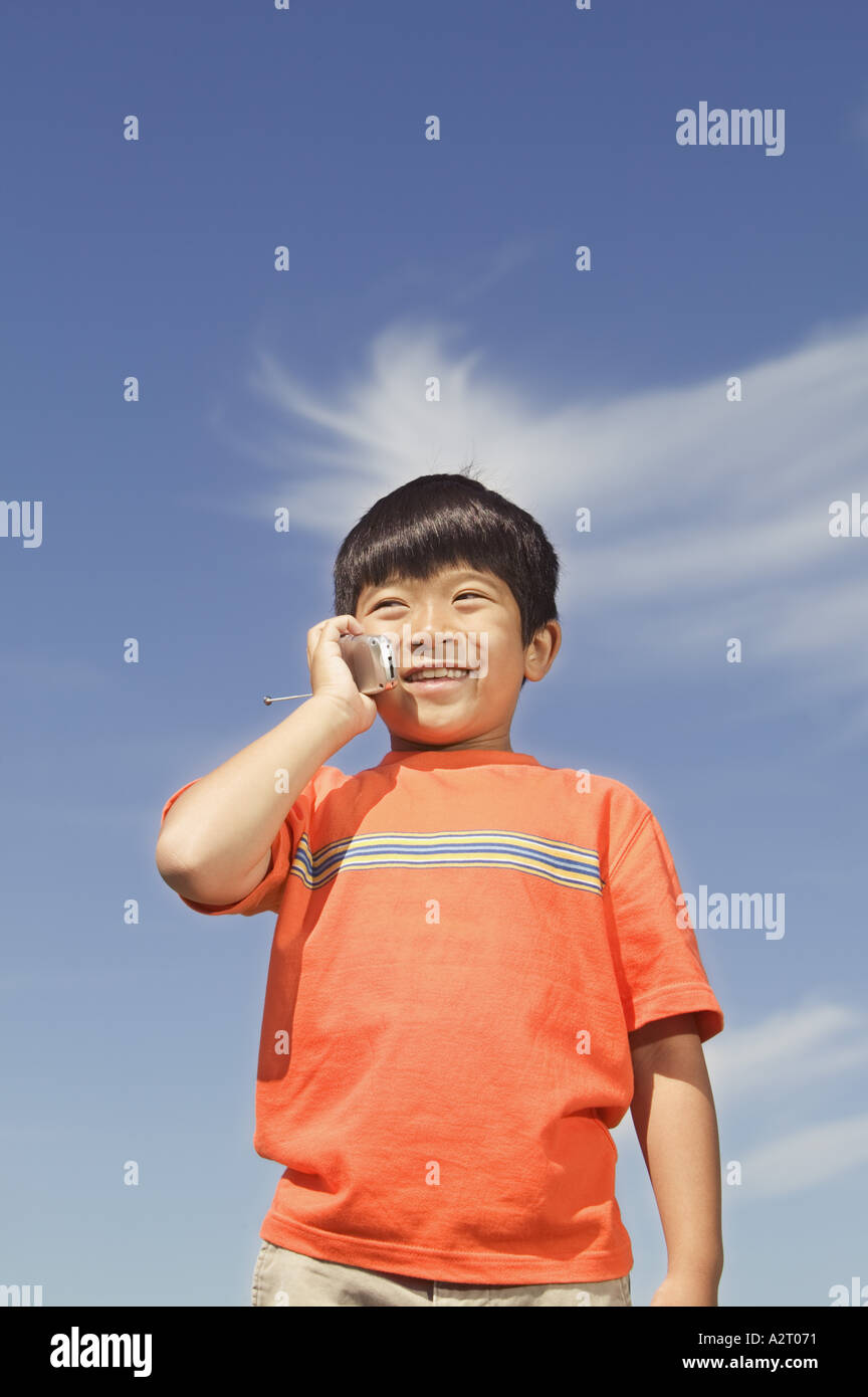 Young boy using his mobile phone Stock Photo - Alamy