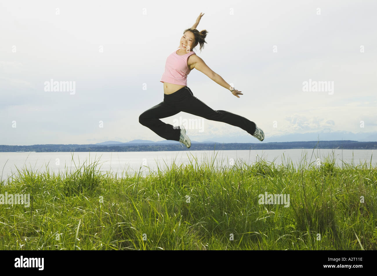 Athletes leap through the water jump hi-res stock photography and ...
