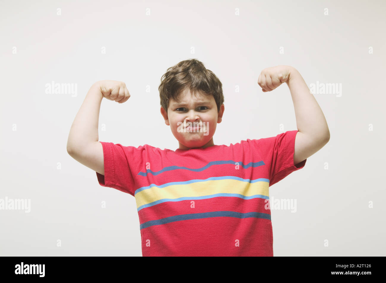 Kid flexing muscle hi-res stock photography and images - Alamy