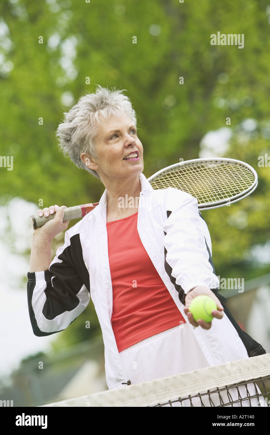A middle aged woman playing tennis Stock Photo - Alamy