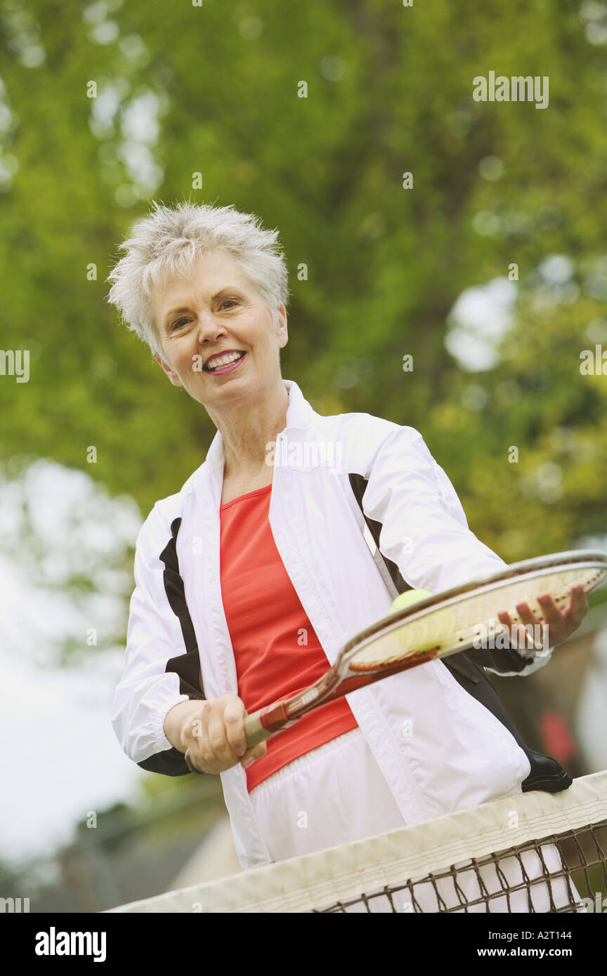 A middle aged woman playing tennis Stock Photo - Alamy