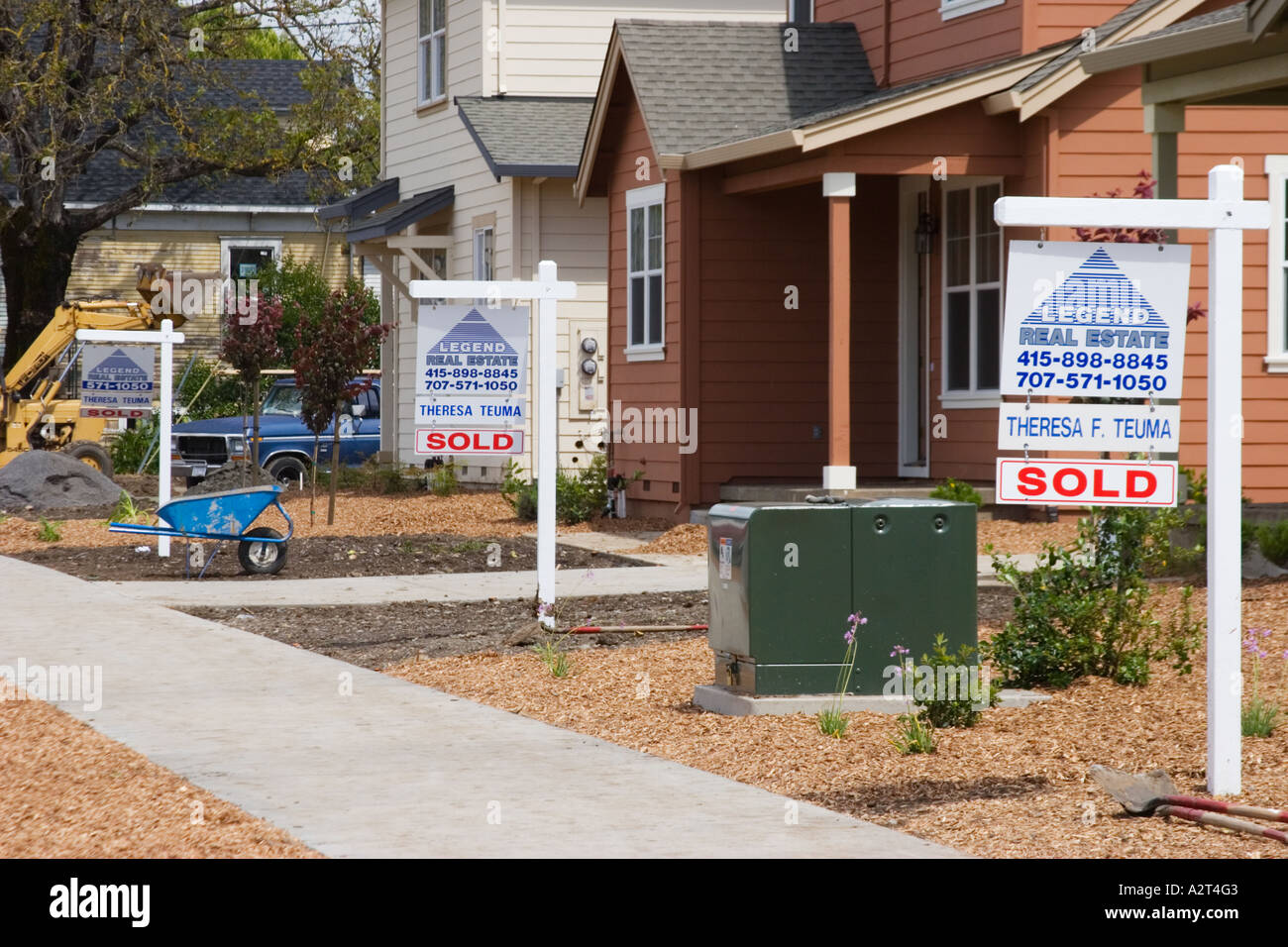 Real Estate signs indicate newly built homes that were sold before ...