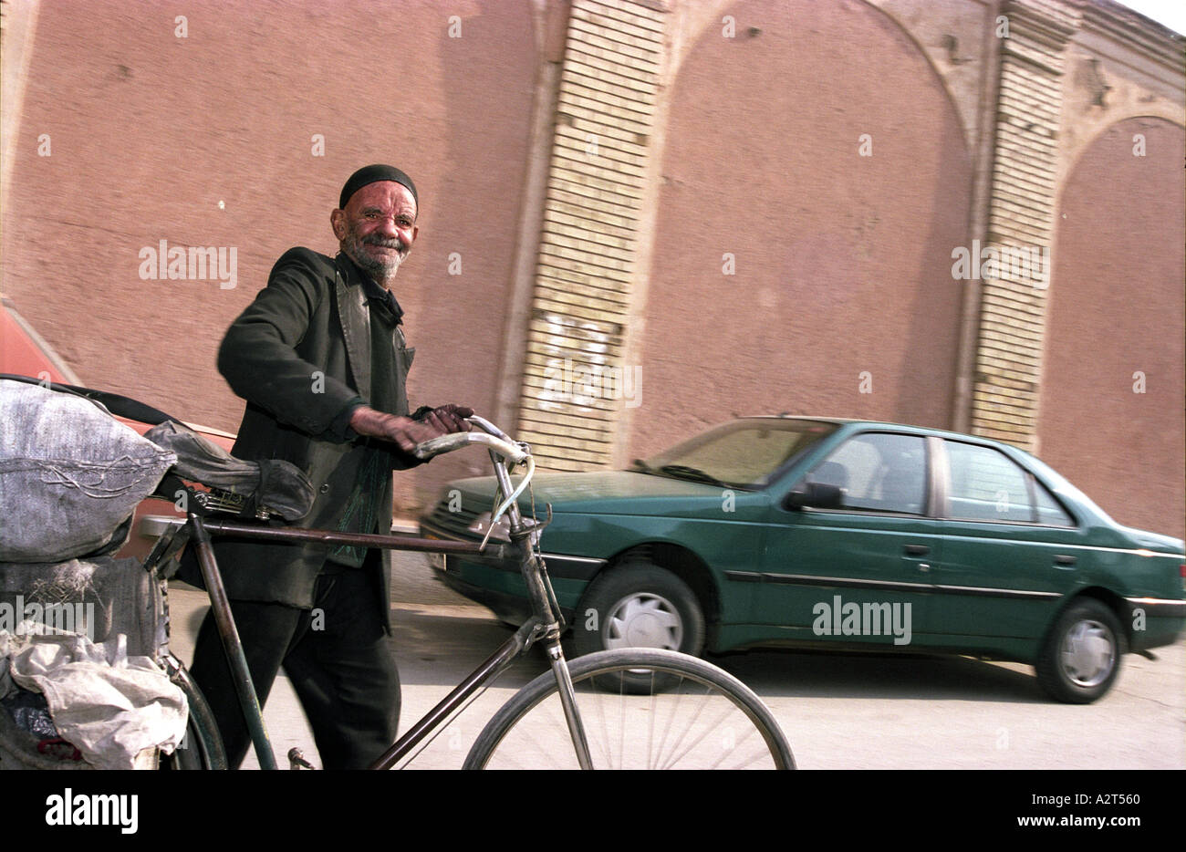 An old man near the church gates Stock Photo - Alamy