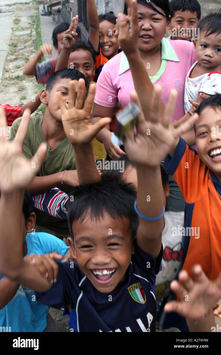 Balinese Children cheering to the camera Stock Photo - Alamy
