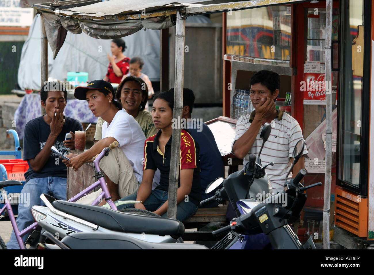 young Balinese people in a bus stop in Ubud Bali Stock Photo - Alamy