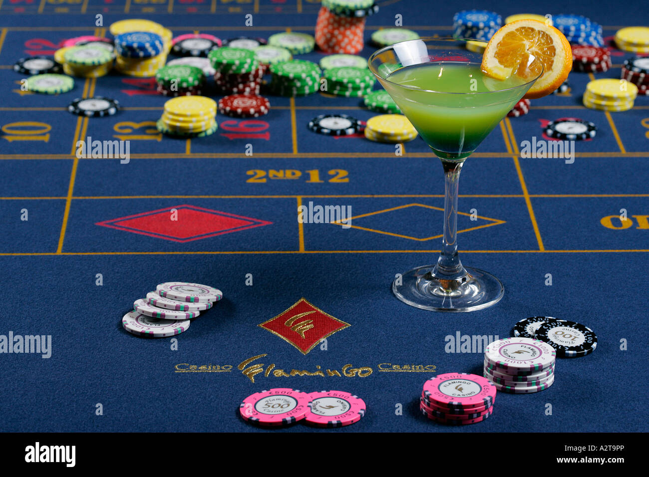 Close up of a casino roulette table cocktail glass reflection adult ...