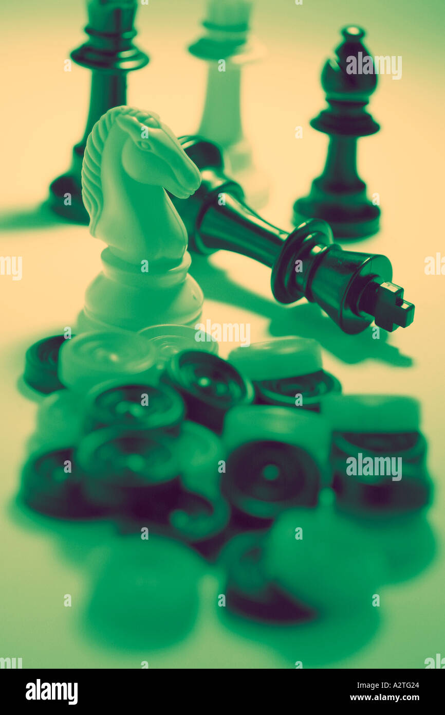 Checkers and Chess Pieces Stock Photo - Alamy