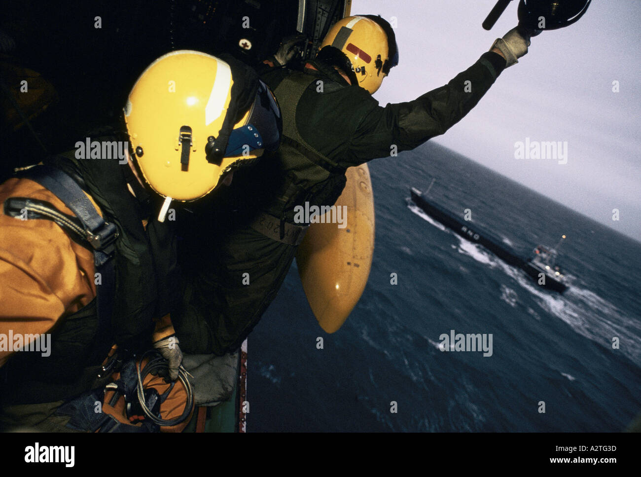 air sea rescue sea king helicopter deck exercise winchman being lowered ...