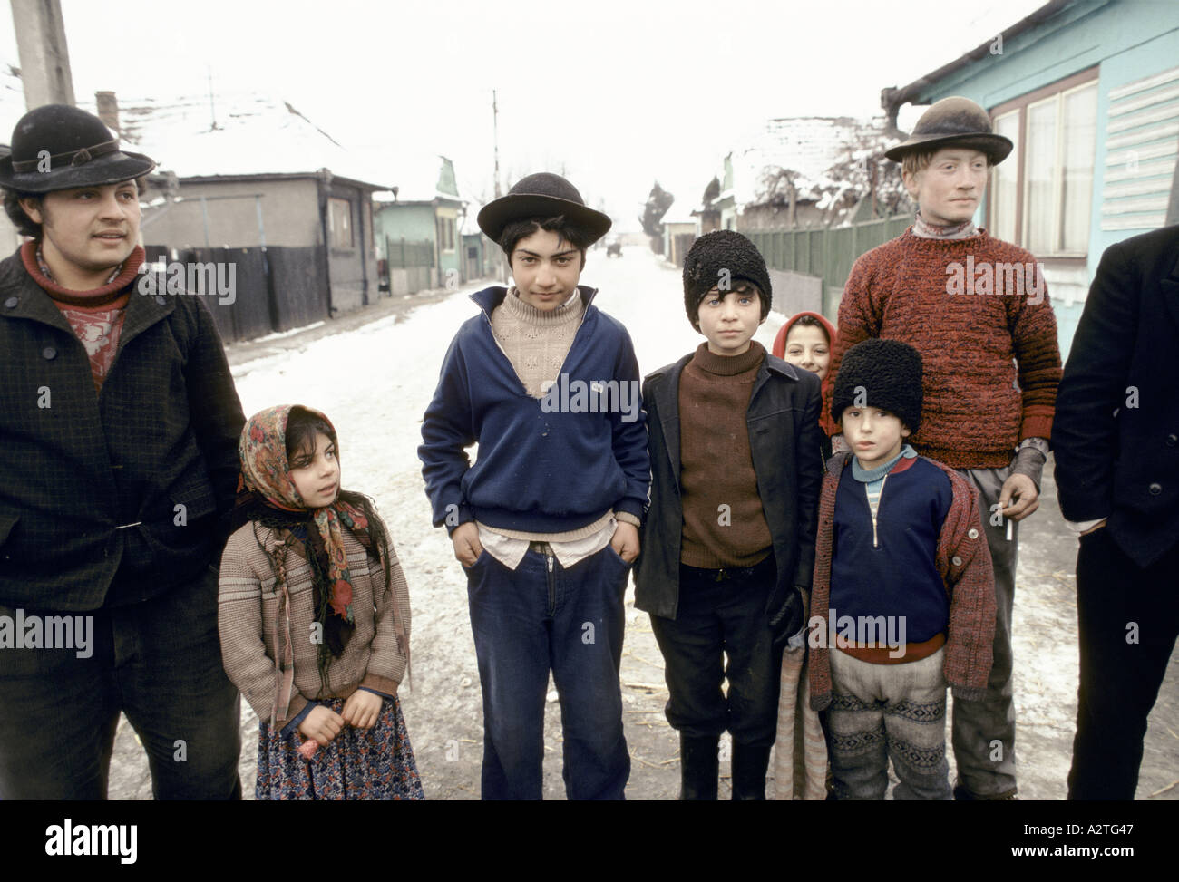 group of romanian travellers gypsies standing in village street near ...