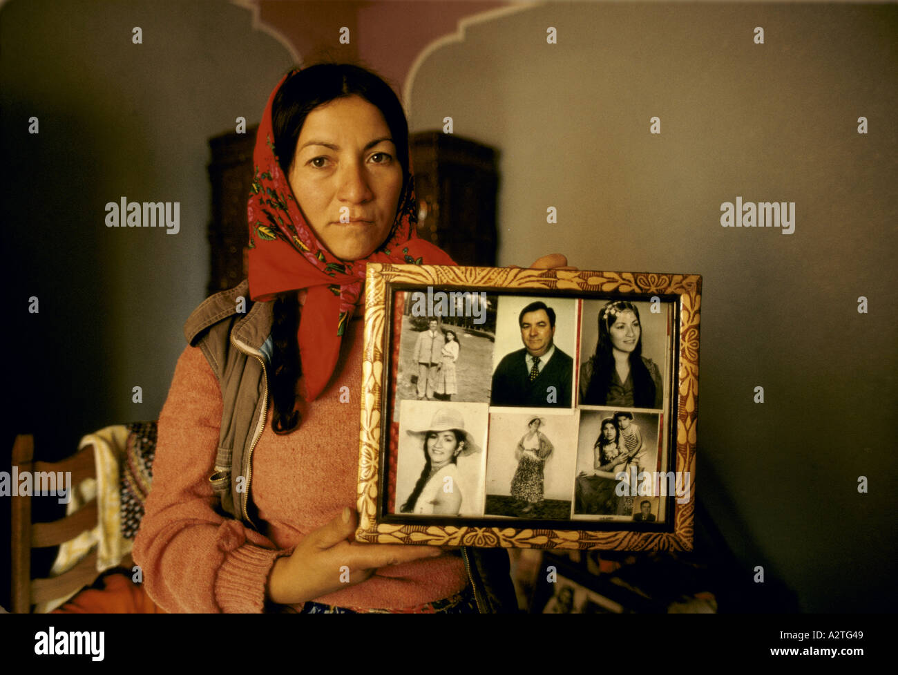 gypsy woman holding frame of photos 1988 Stock Photo - Alamy