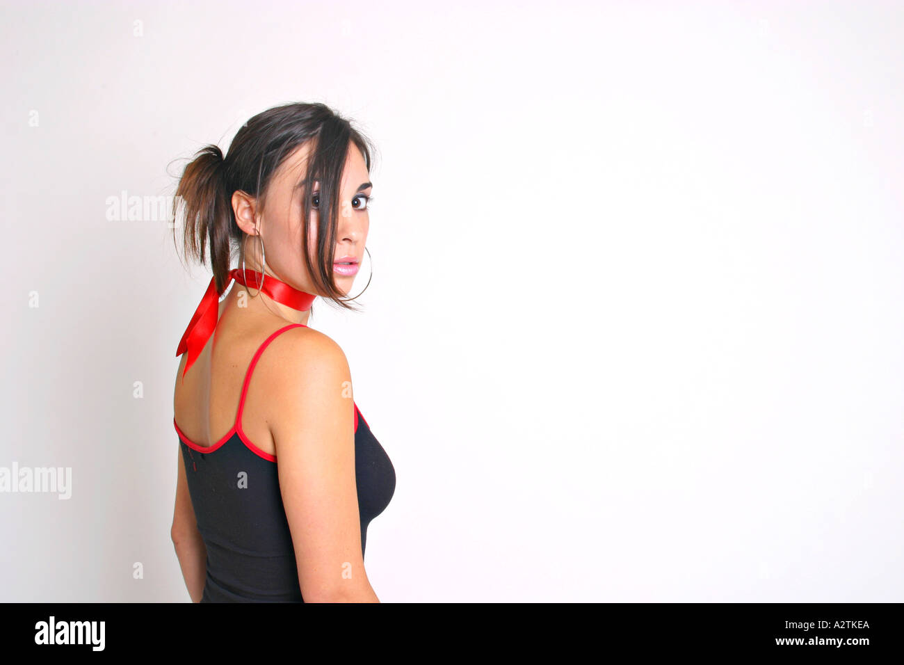 Medium shot from the back of a young woman with black and red top ...