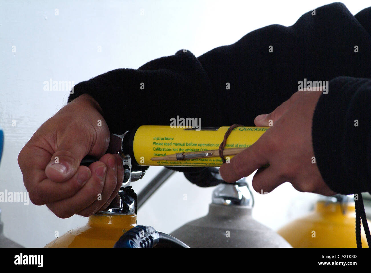 Diver checking a nitrox tank during a live aboard cruise diving Stock ...