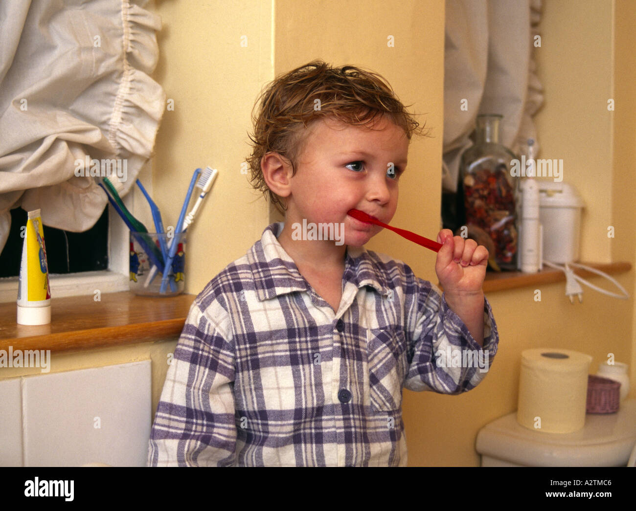 Toddler aged 3 brushing teeth Stock Photo - Alamy