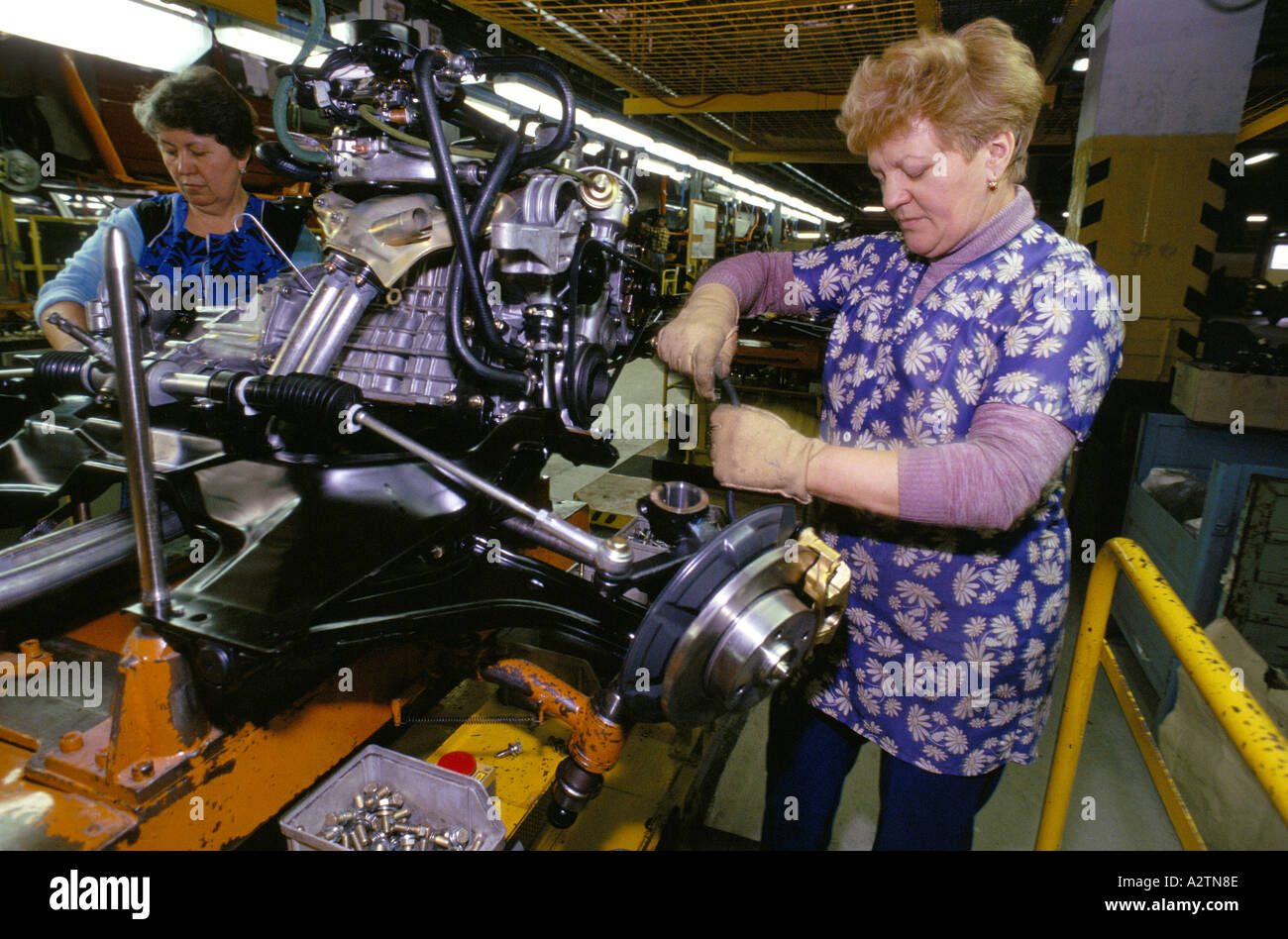 People Working In A Car Factory