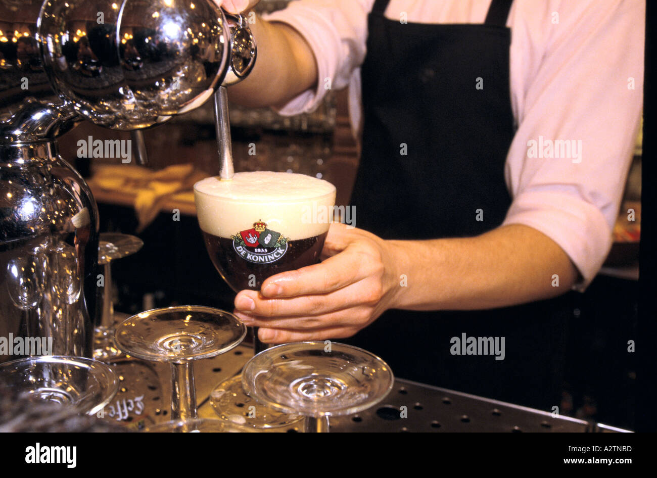 bartender serving beer antwerp Stock Photo - Alamy