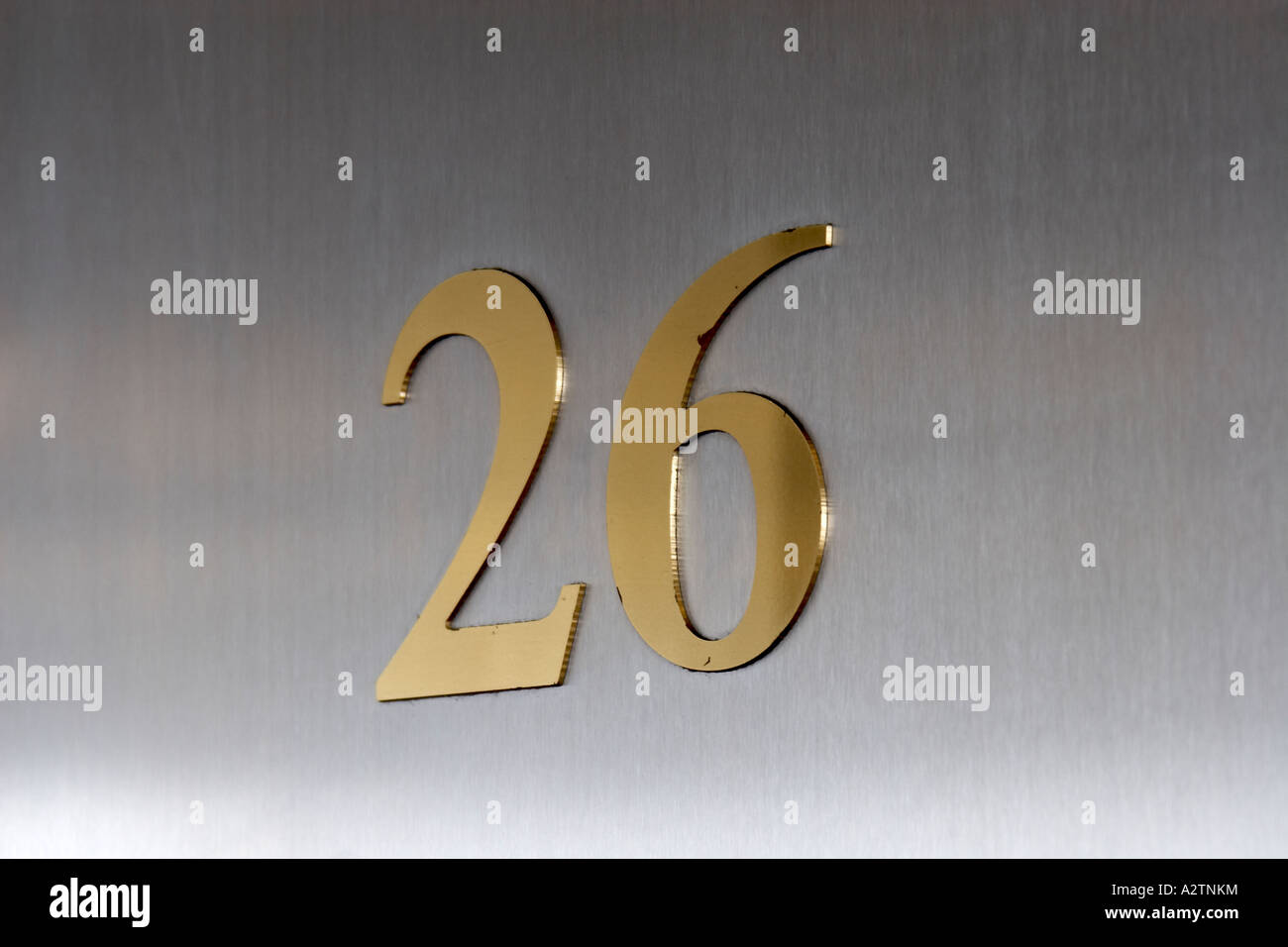 Number twenty six 26 in brass Stock Photo - Alamy